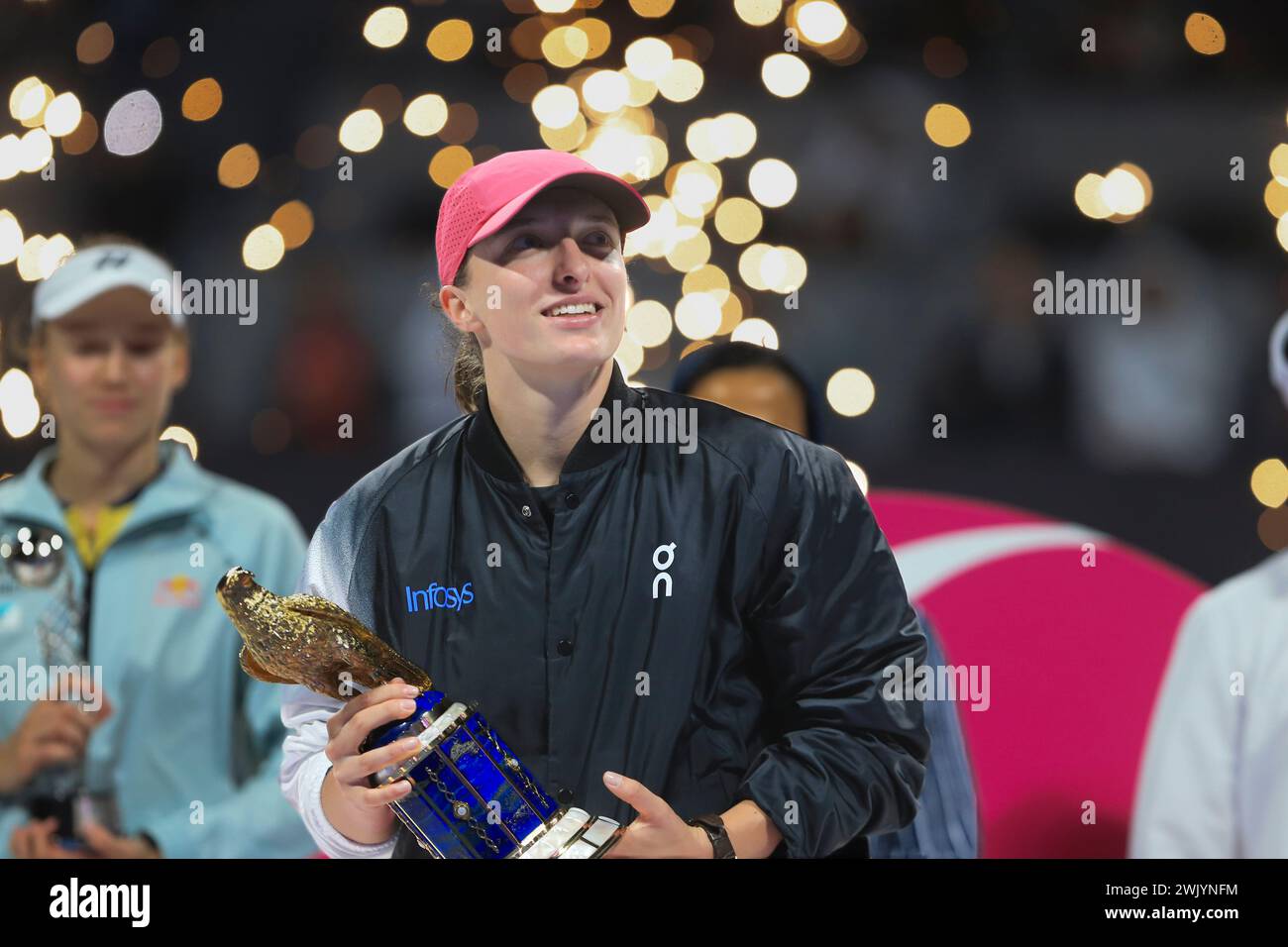 Poland's Iga Swiatek holds the trophy after winning the Qatar Open ...