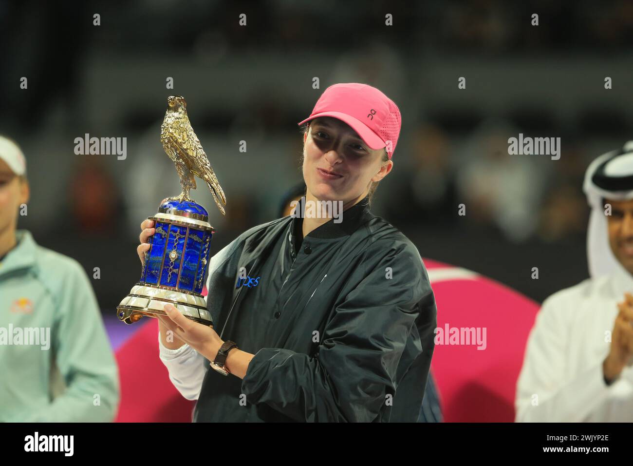 Poland's Iga Swiatek holds the trophy after winning the Qatar Open ...