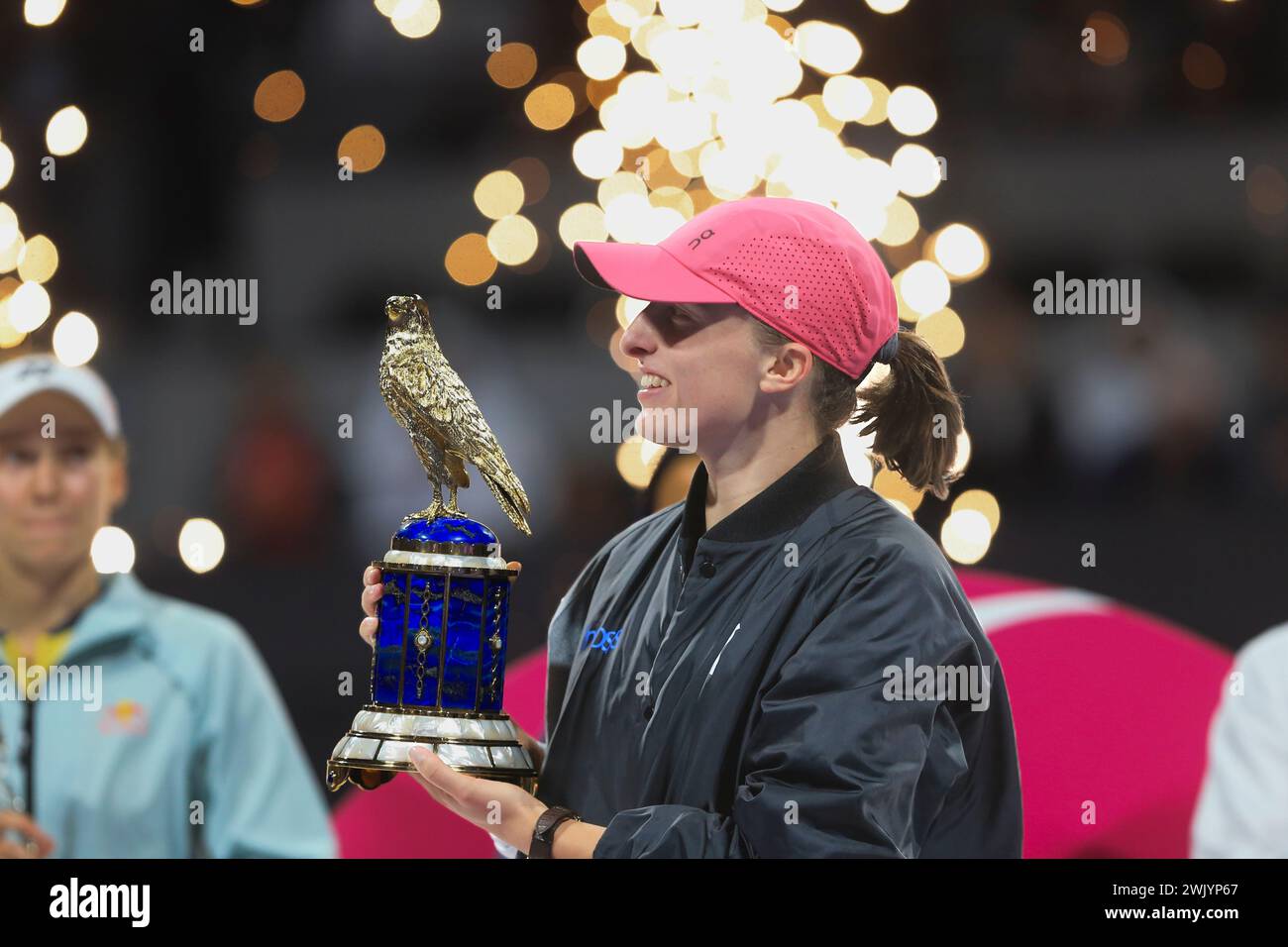 Poland's Iga Swiatek holds the trophy after winning the Qatar Open ...