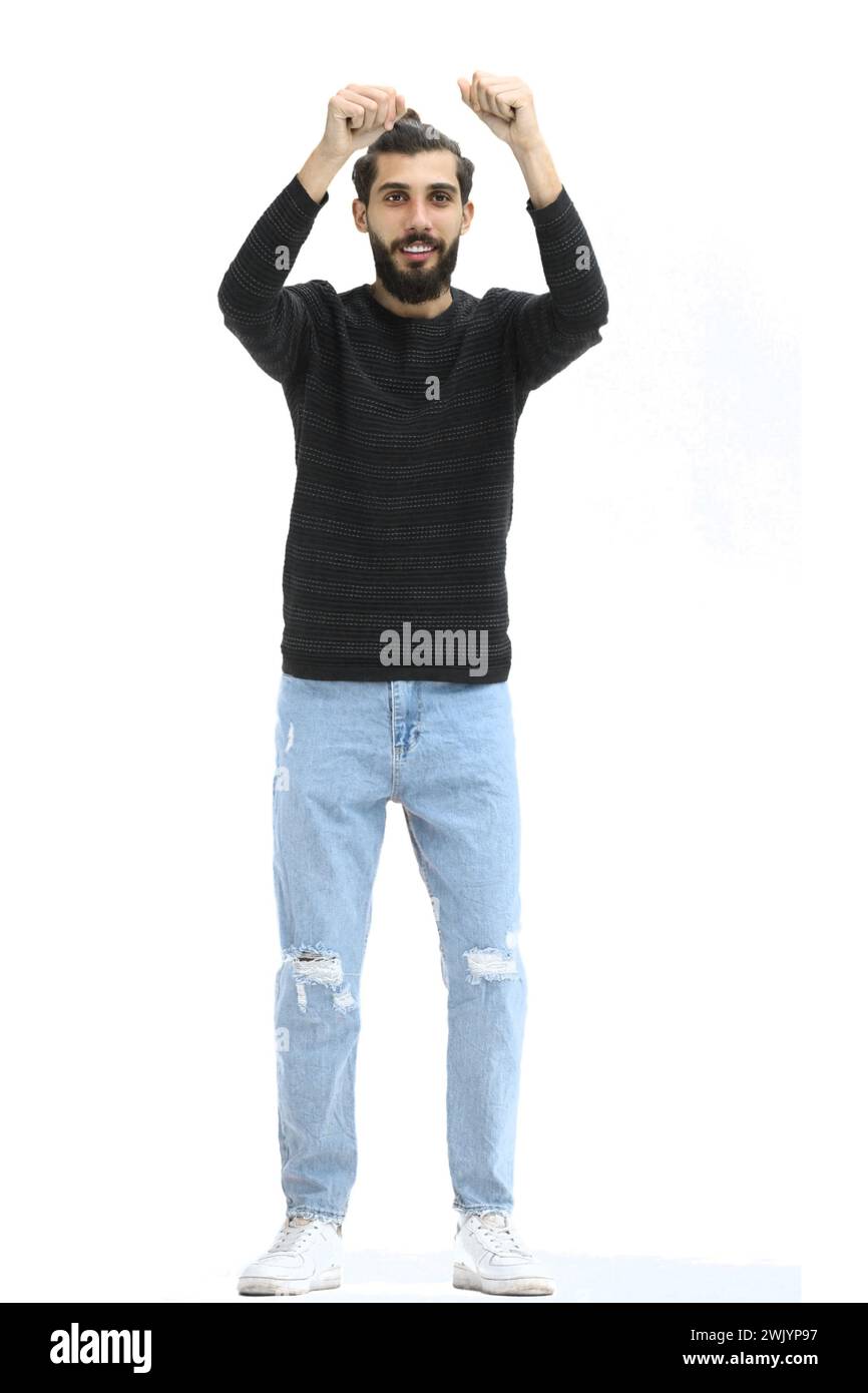 A man, full-length, on a white background, raised his hands up Stock ...
