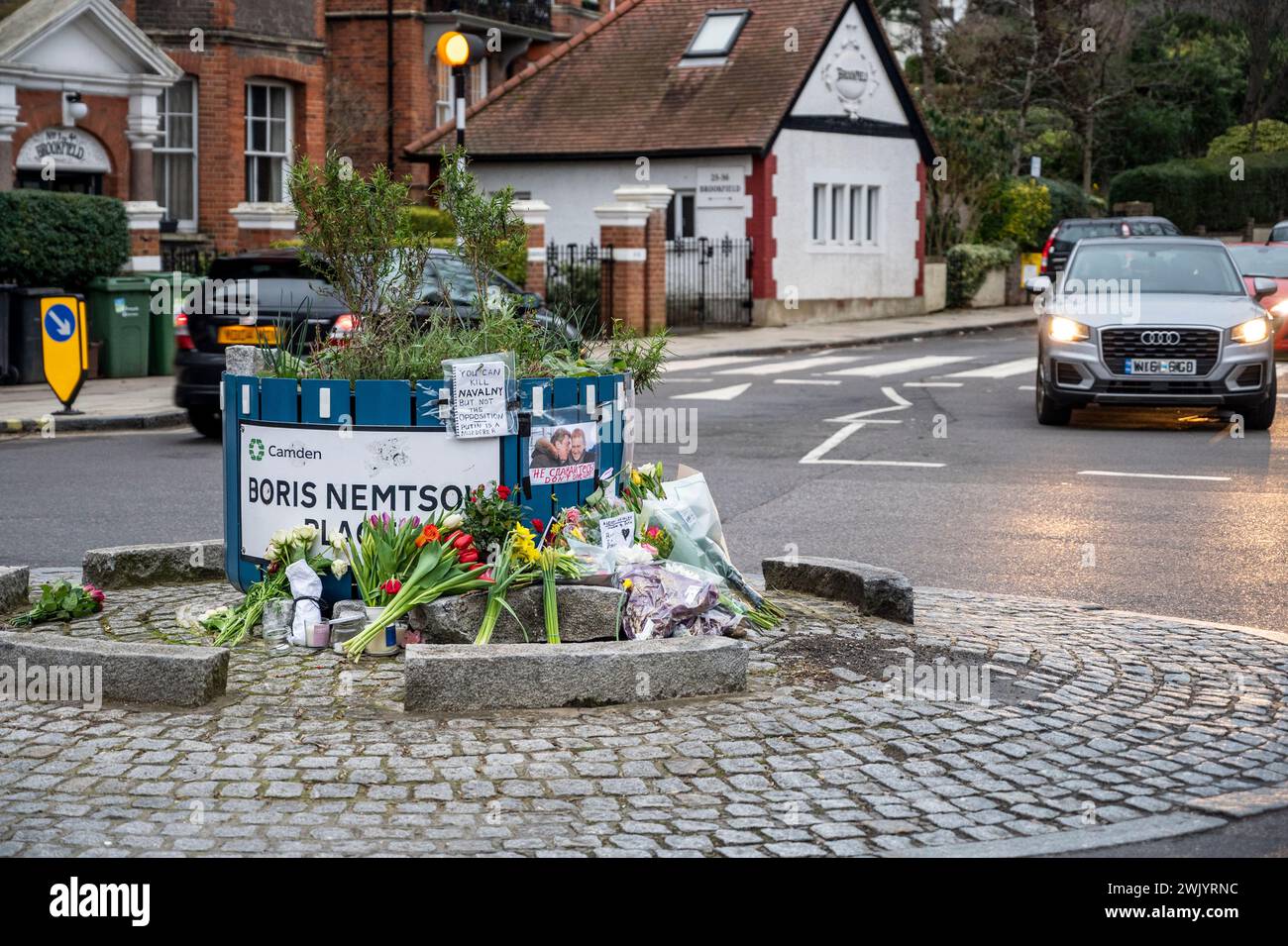 A shrine to Alexei Navalny at Boris Nemstov Place, London with flowers ...