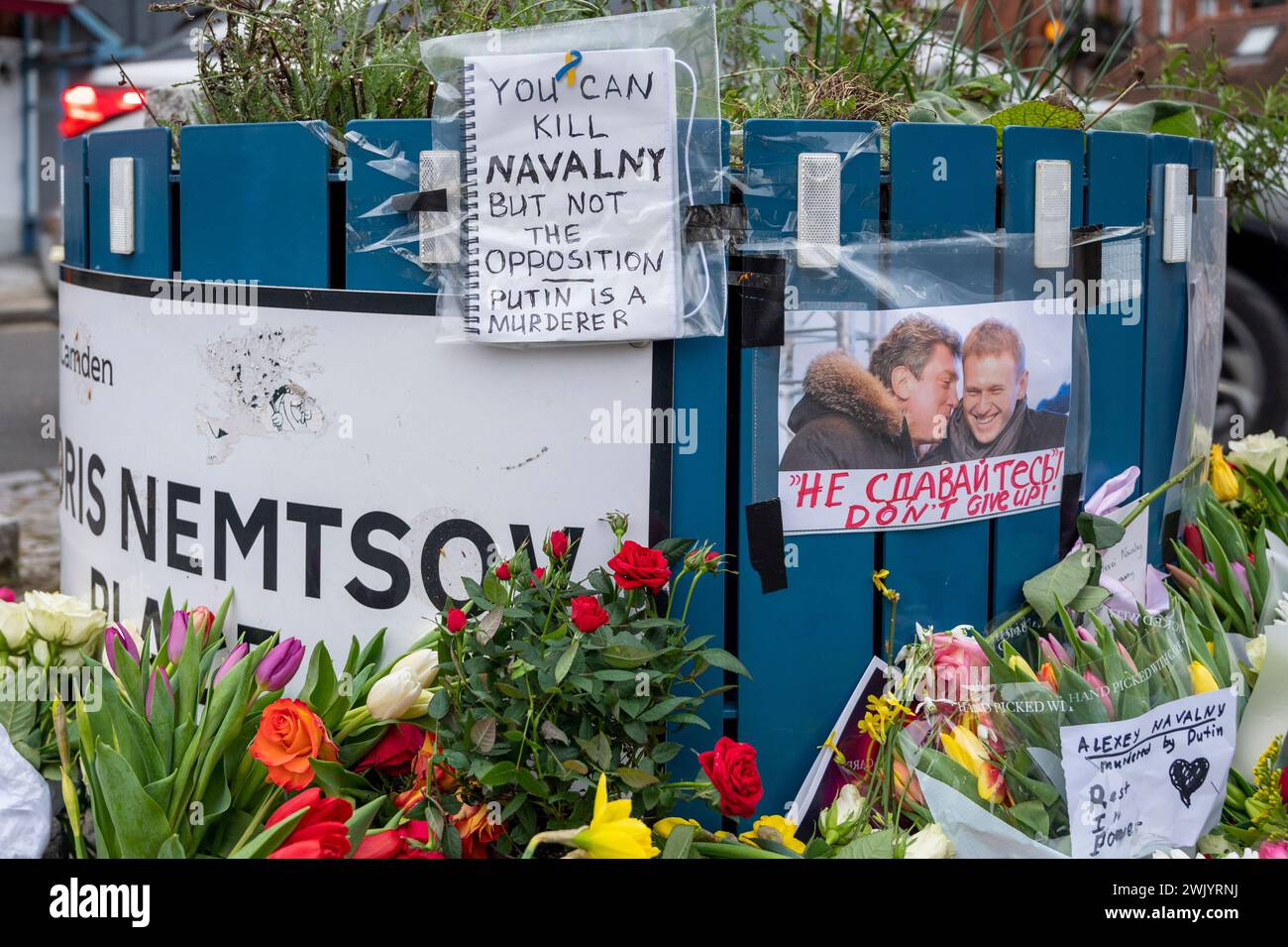A shrine to Alexei Navalny at Boris Nemstov Place, London with flowers ...
