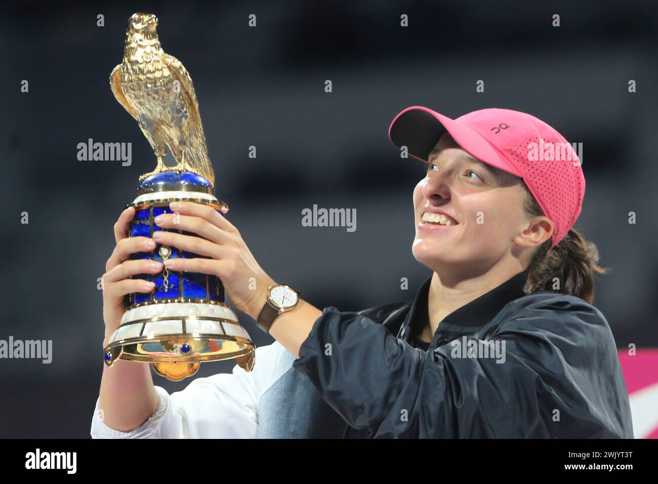Poland's Iga Swiatek holds the trophy after winning the Qatar Open ...