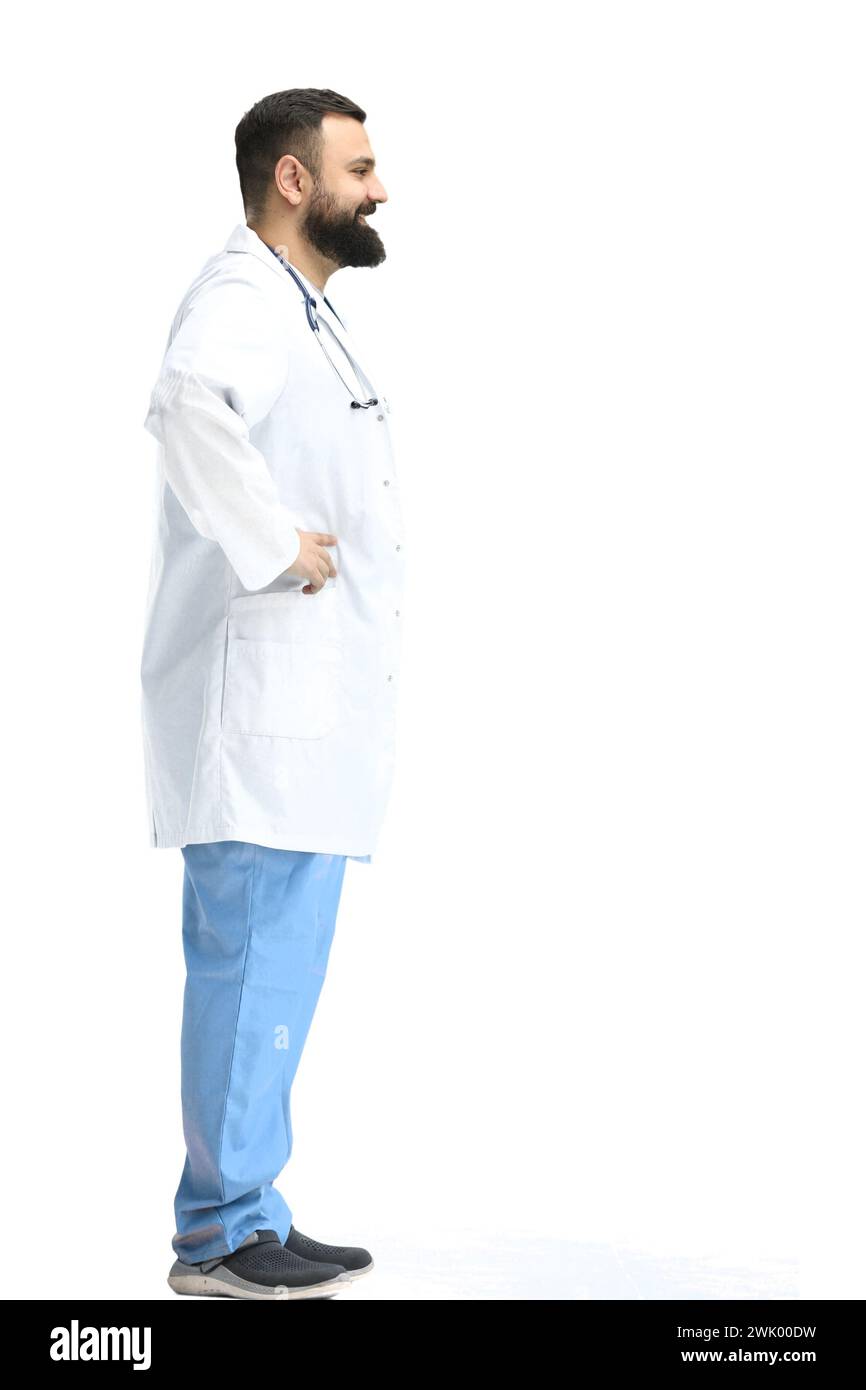 Male doctor, full-length, on a white background, hands on hips Stock ...