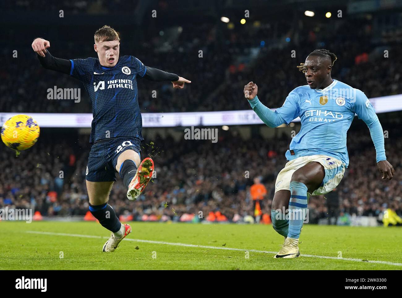 Chelsea's Cole Palmer (left) and Manchester City's Jeremy Doku in ...