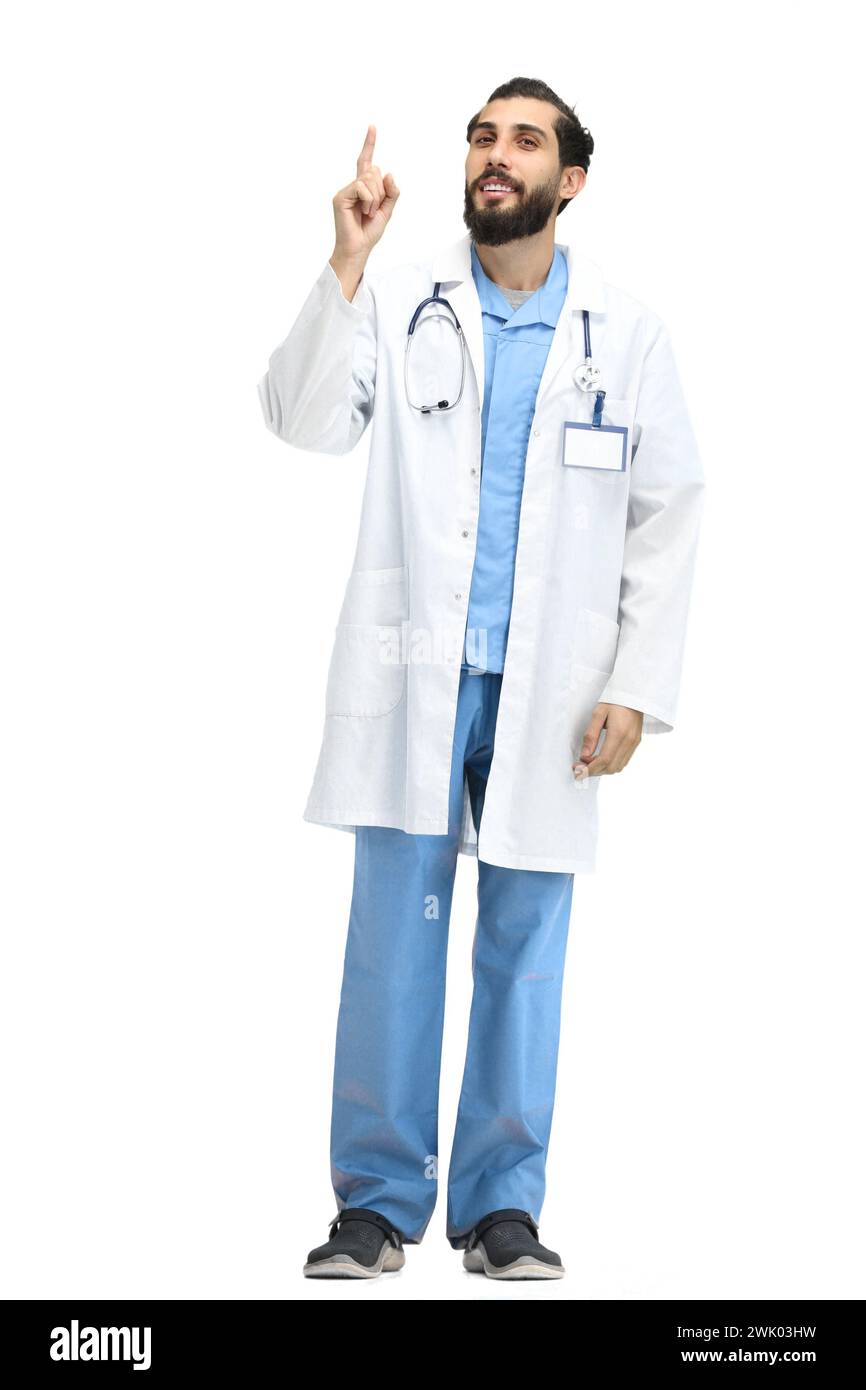 The male doctor, full-length, on a white background, points up Stock ...