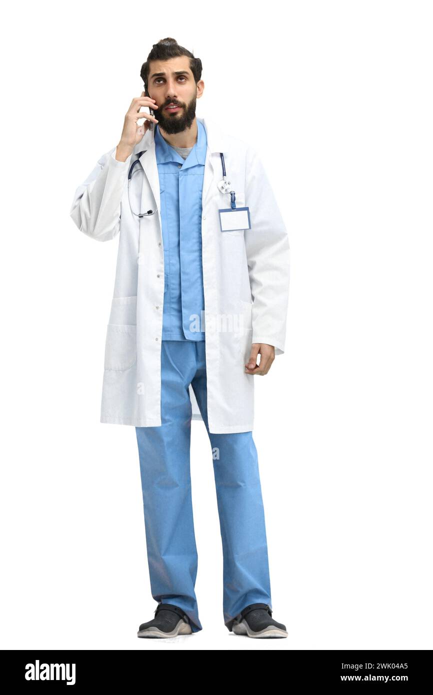 Male doctor, full-length, on a white background, with a phone Stock ...