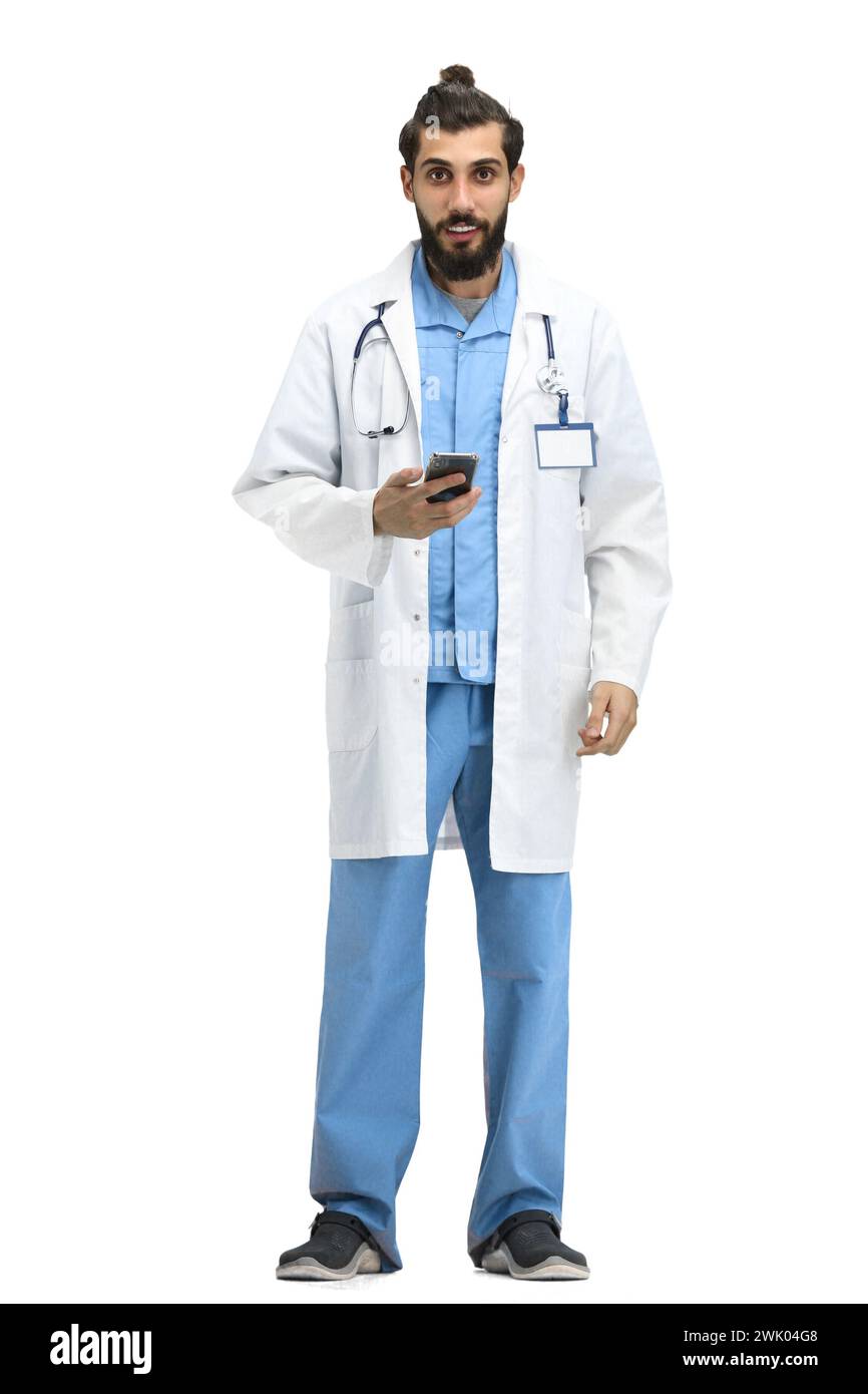 Male doctor, full-length, on a white background, with a phone Stock ...