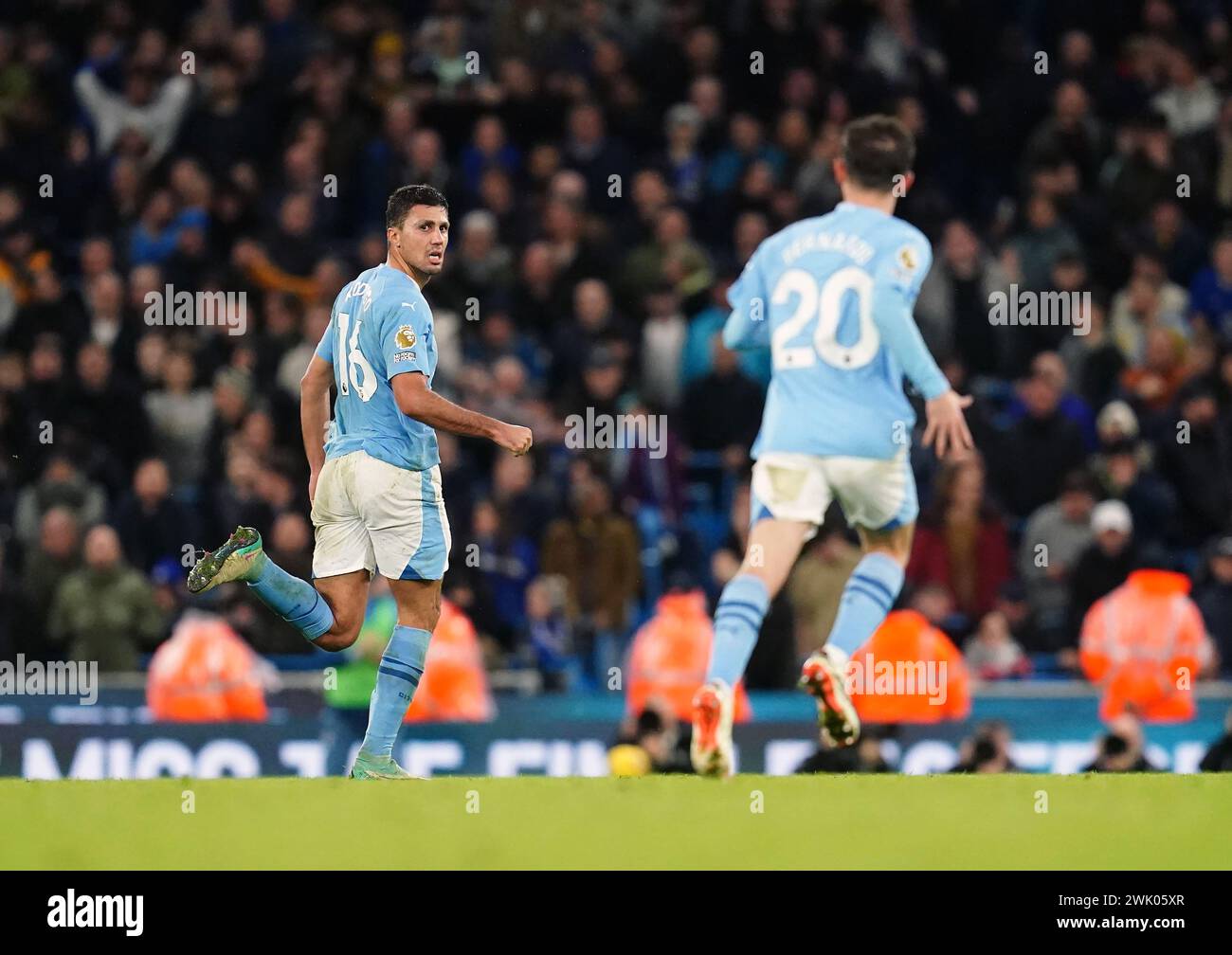 Manchester City's Rodri (left) celebrates scoring their side's first ...