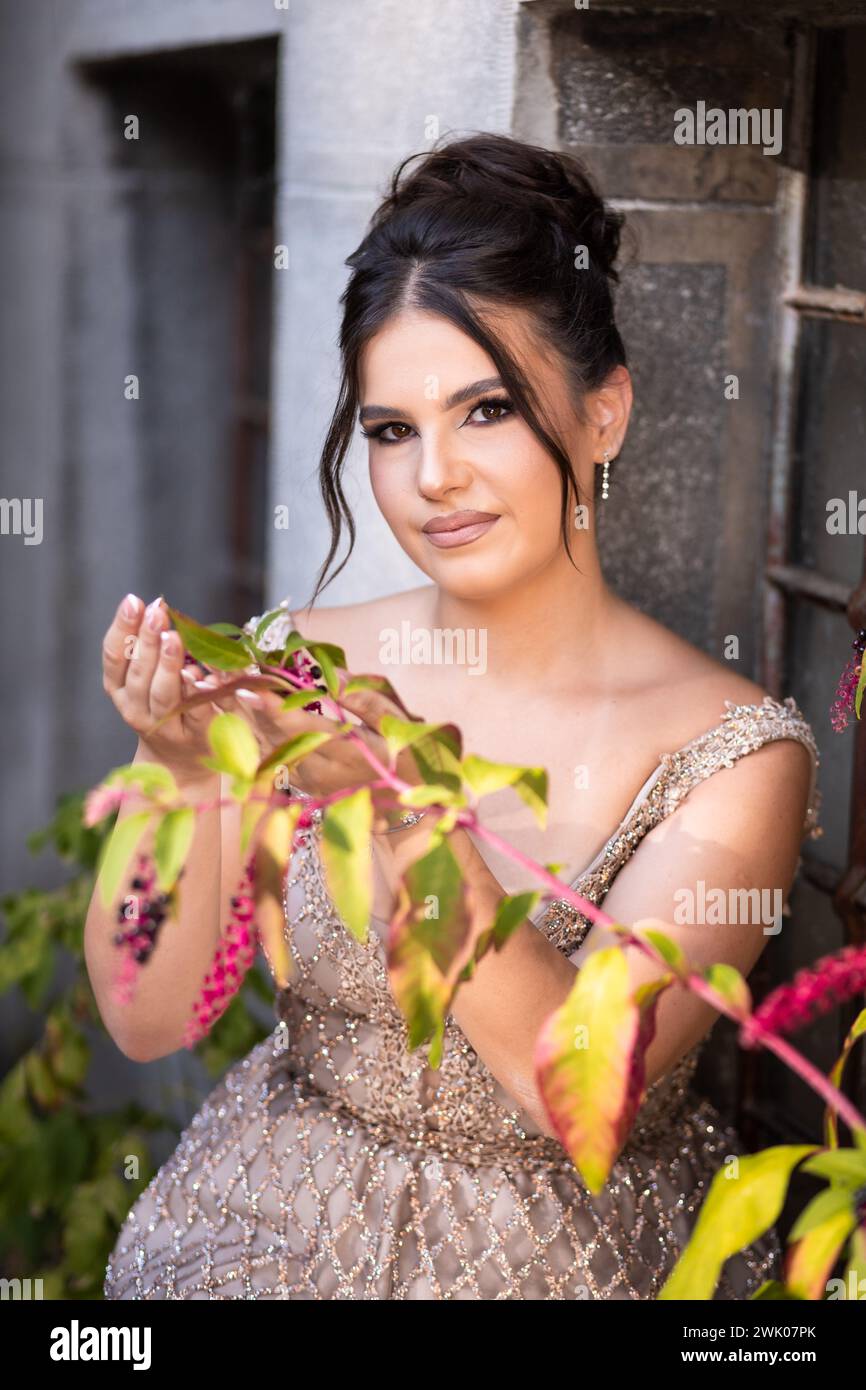 Close up portrait of a teen brunette girl in a golden dress. Ready for ...