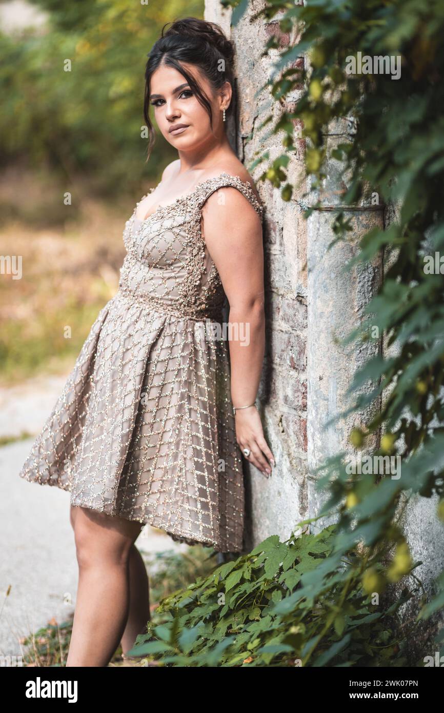 Beautiful teen brunette girl in a golden dress. Ready for prom Stock ...