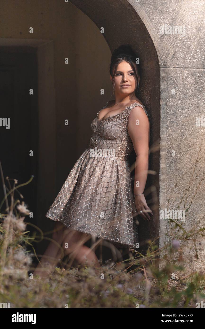 Beautiful teen brunette girl in a golden dress. Ready for prom Stock ...