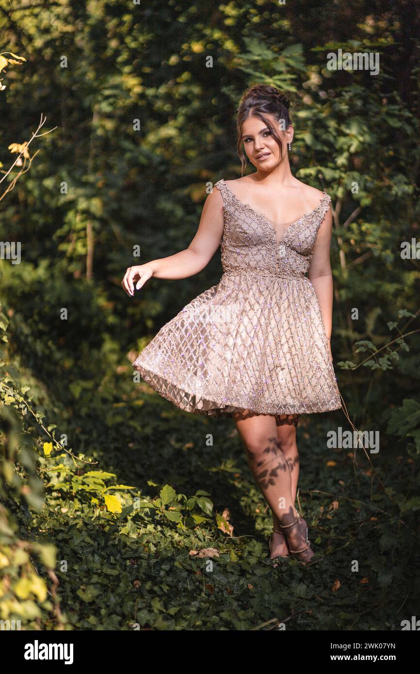 Beautiful teen brunette girl in a golden dress. Ready for prom Stock ...