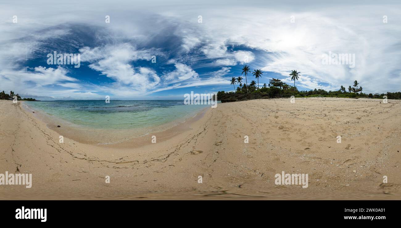 Ocean waves on sandy beach. Blue sky and clouds. Carabao Island in ...