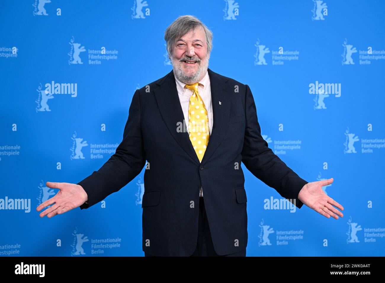 Berlin, Germany. 17th Feb, 2024. Stephen Fry, actor, gestures during ...