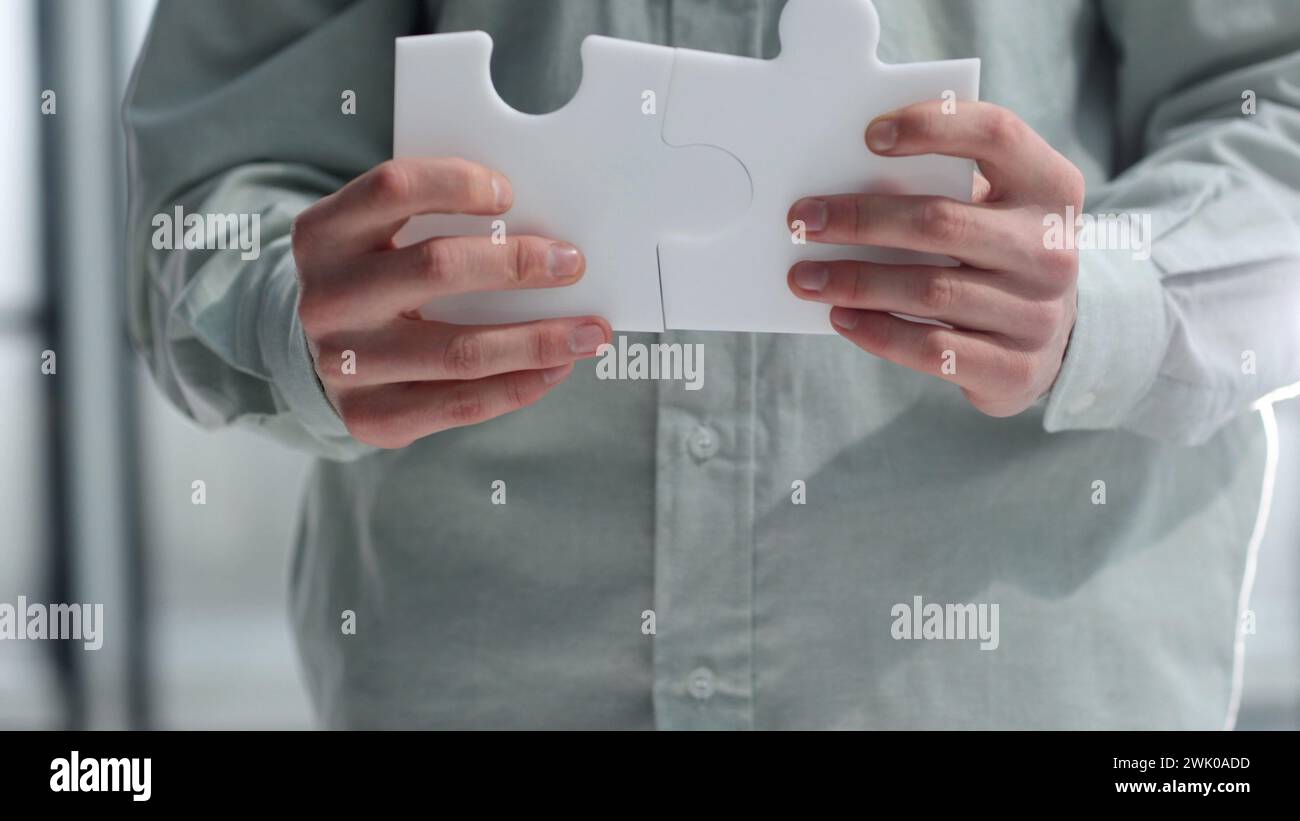 Adding important business elements in teamwork Stock Photo - Alamy