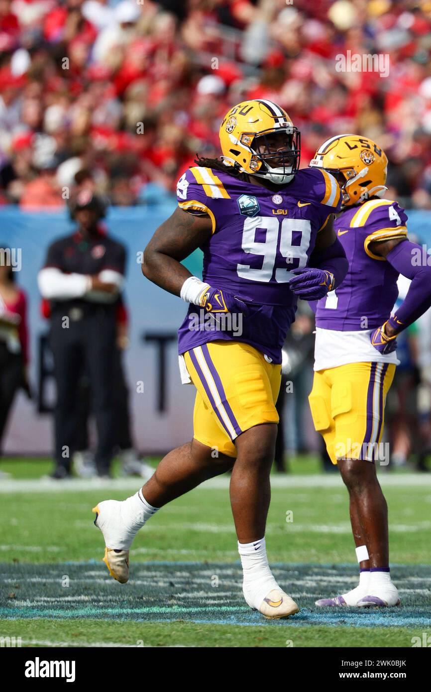 LSU Tigers defensive tackle Jordan Jefferson (99) runs off the field ...
