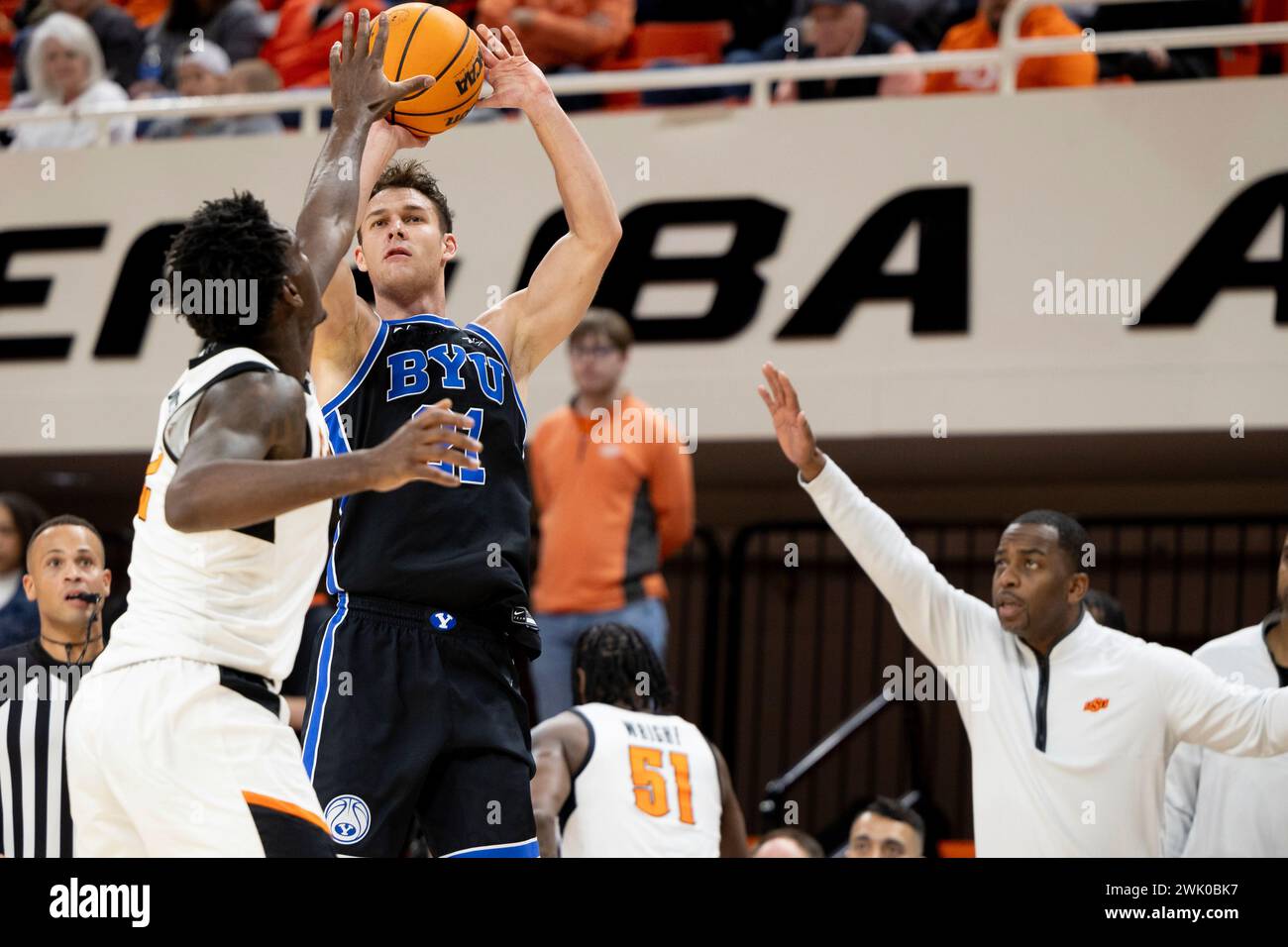 BYU guard Trevin Knell (21) shoots over Oklahoma State forward Eric ...
