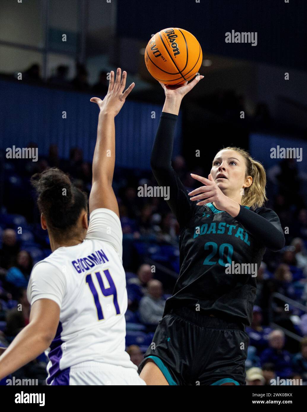 Coastal Carolina center Riley Stack (20) takes a shot over James ...