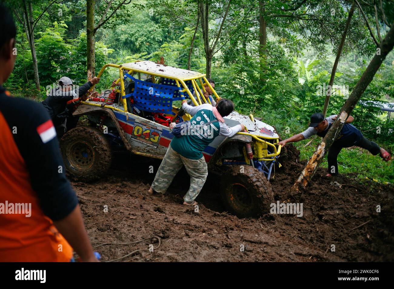 The organizing committee is evacuating an off-road car that crashed on ...