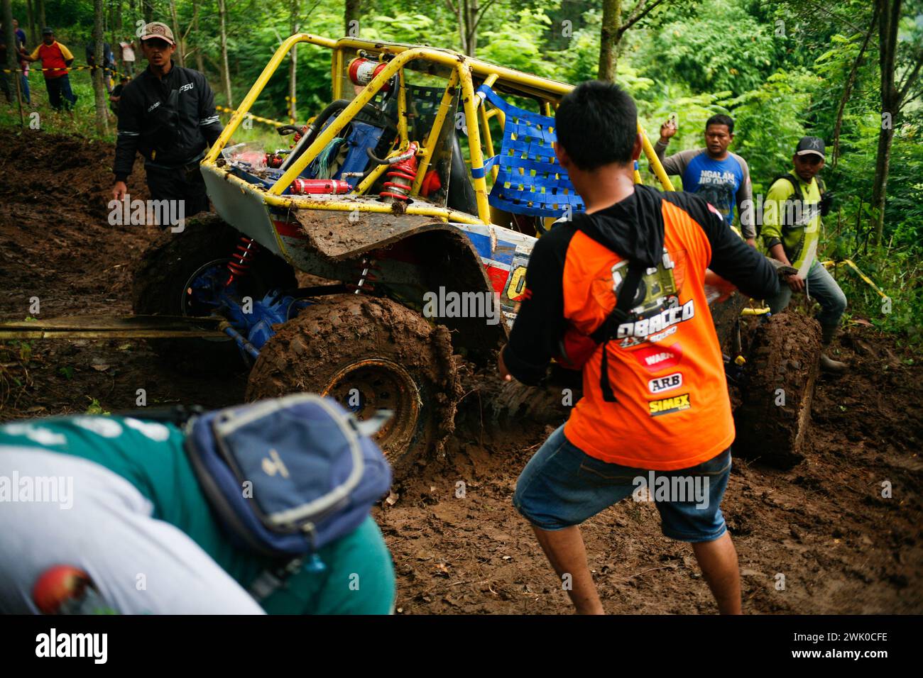 The organizing committee is evacuating an off-road car that crashed on ...