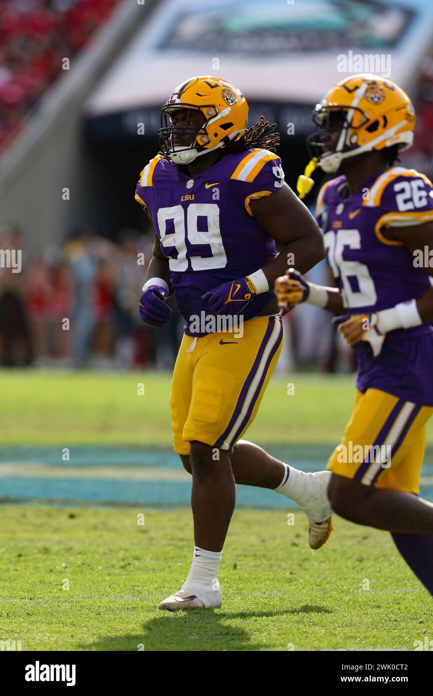 LSU Tigers defensive tackle Jordan Jefferson (99) runs off the field ...