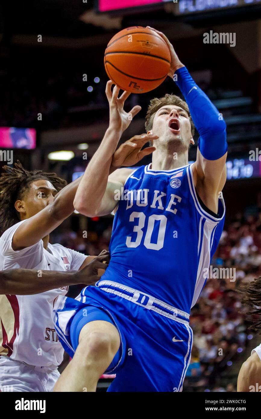 Duke center Kyle Filipowski (30) drives by Florida State forward Baba ...