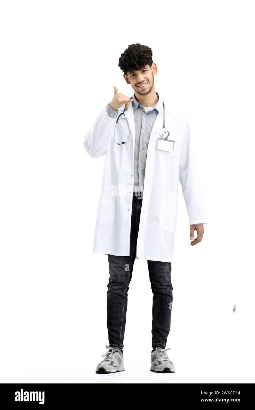 Male doctor, full-length, on a white background, shows a call sign ...