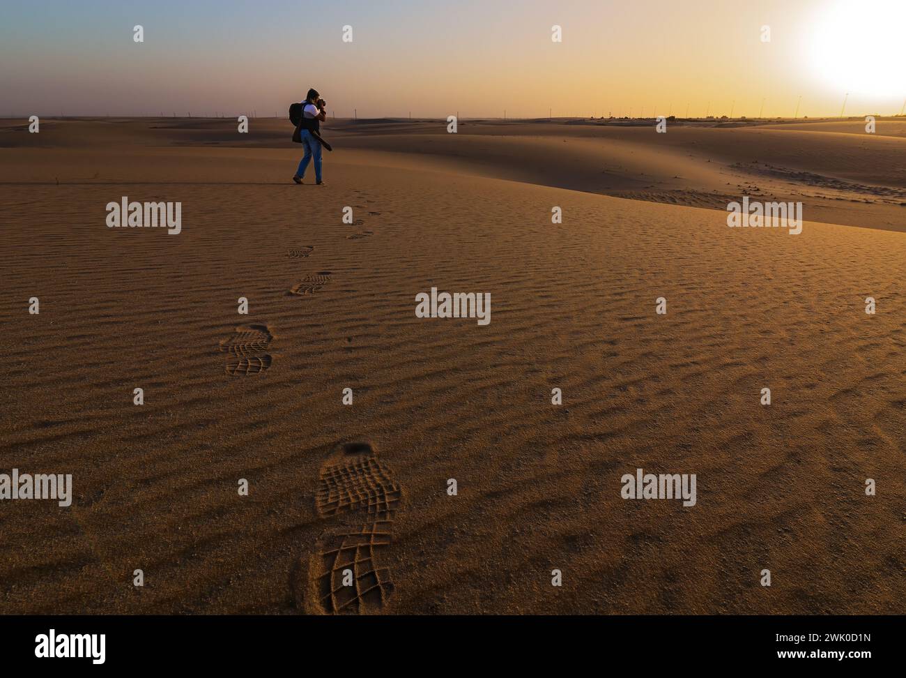 Photographer stands alone in the Desert leaving food steps in Dammam ...