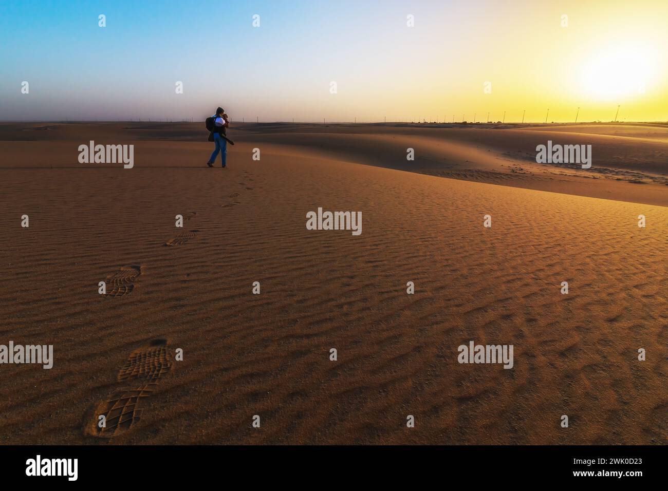 Photographer stands alone in the Desert leaving food steps in Dammam ...