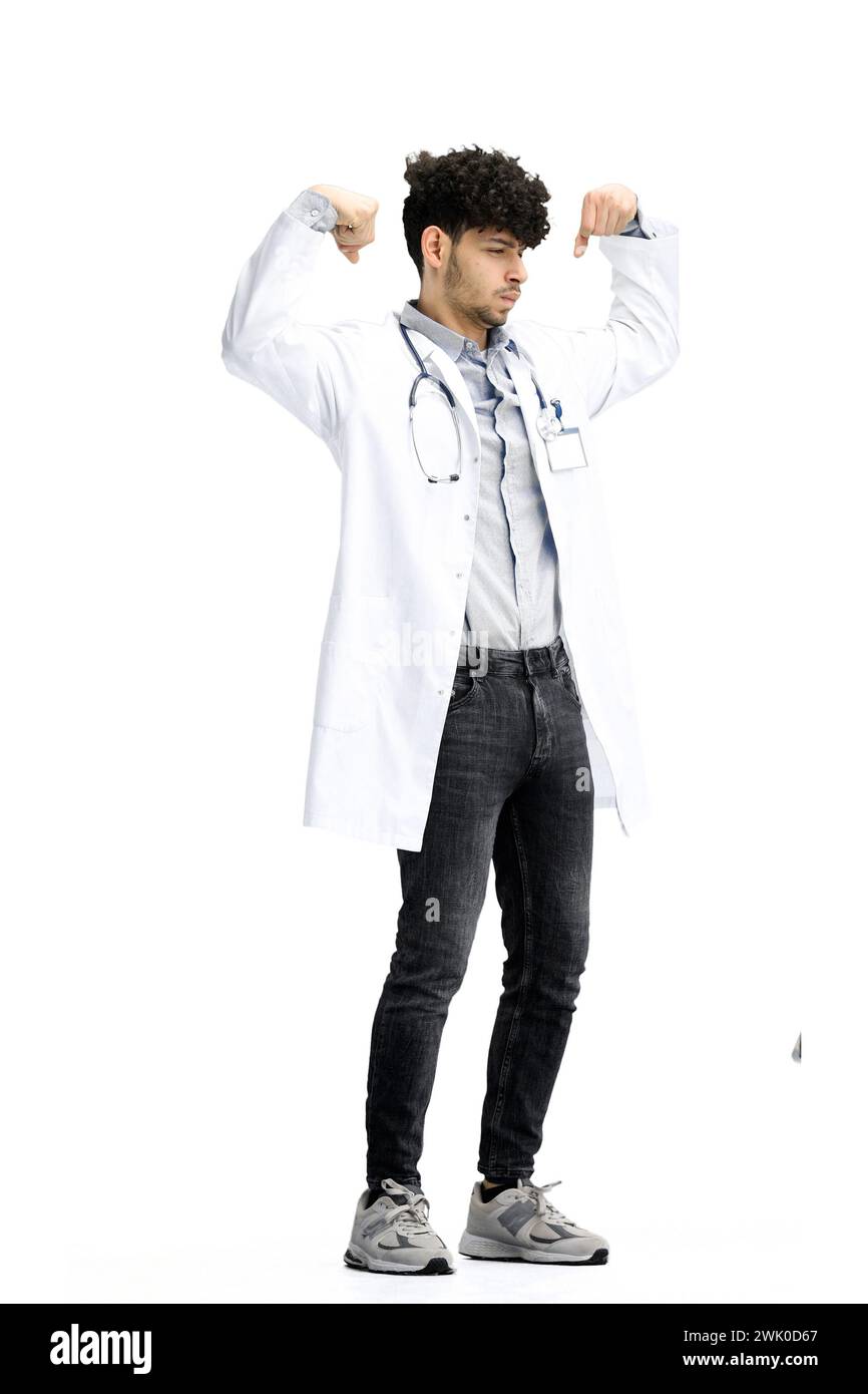Male doctor, full-length, on a white background, shows strength Stock ...
