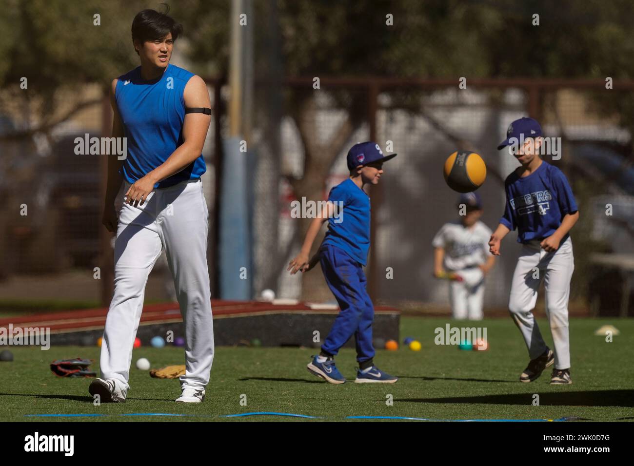Los Angeles Dodgers' Shohei Ohtani walks to the clubhouse during spring ...