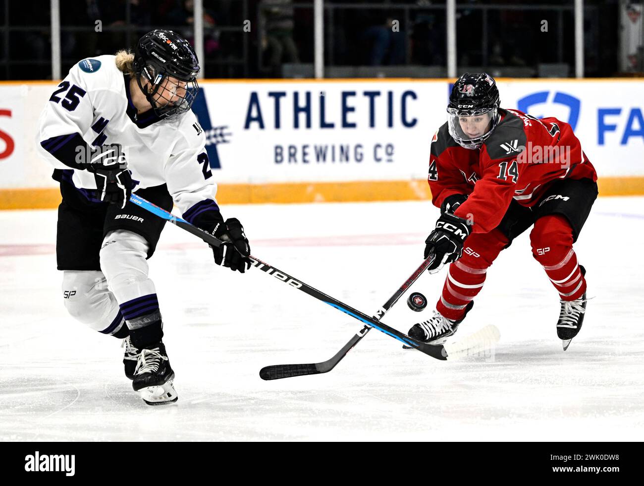 Ottawa's Hayley Scamurra (14) works to settle a bouncing puck as ...