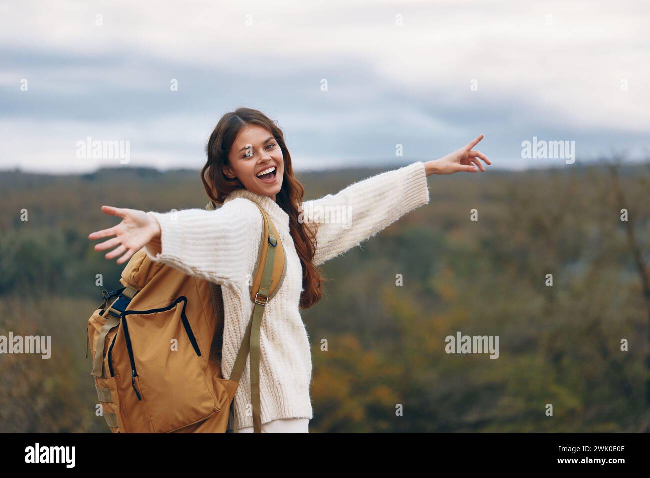 Mountain Adventure: Smiling Woman on Cliff, Embracing Nature's Freedom ...