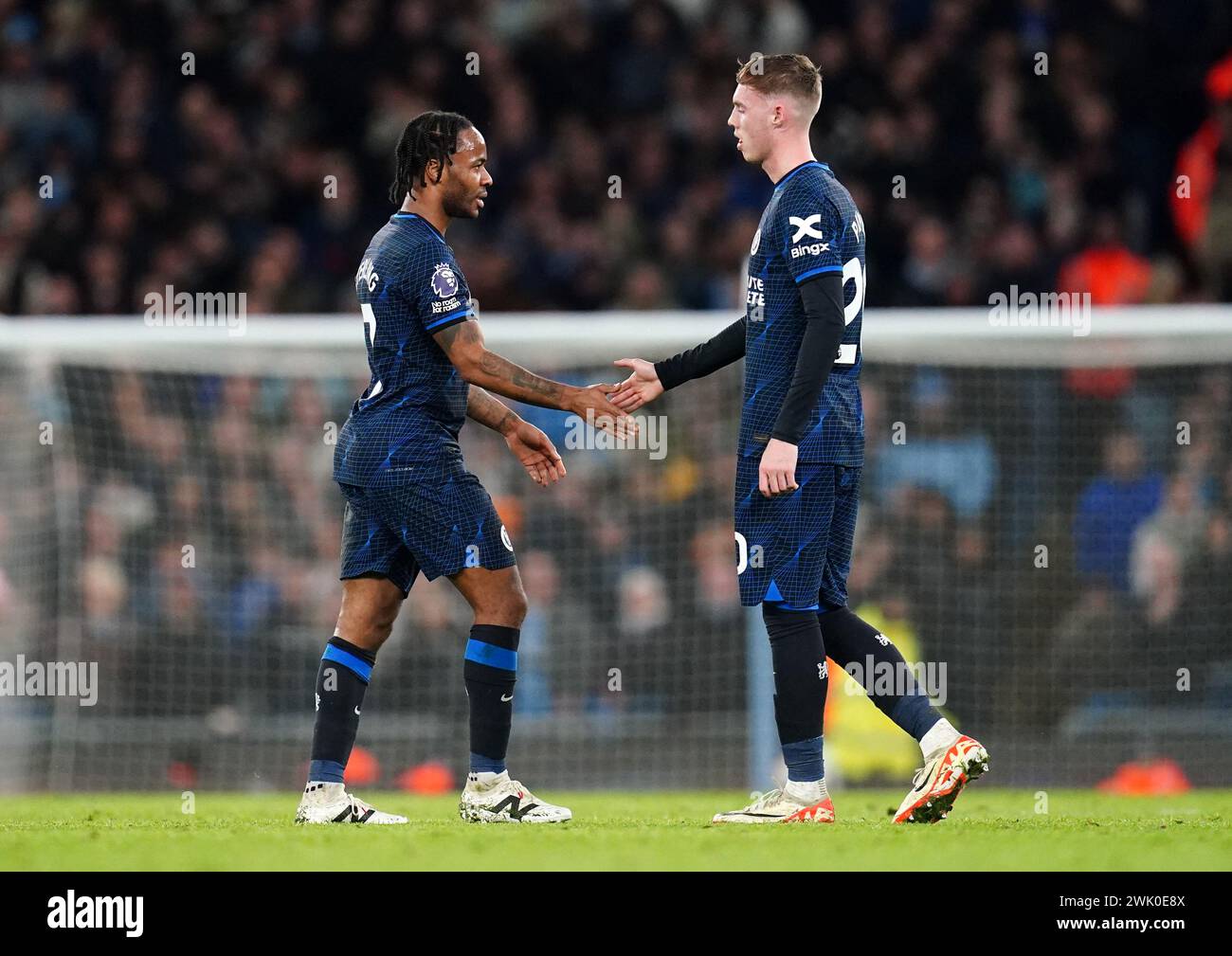 Chelsea's Raheem Sterling greets Cole Palmer as he is subsituted off ...