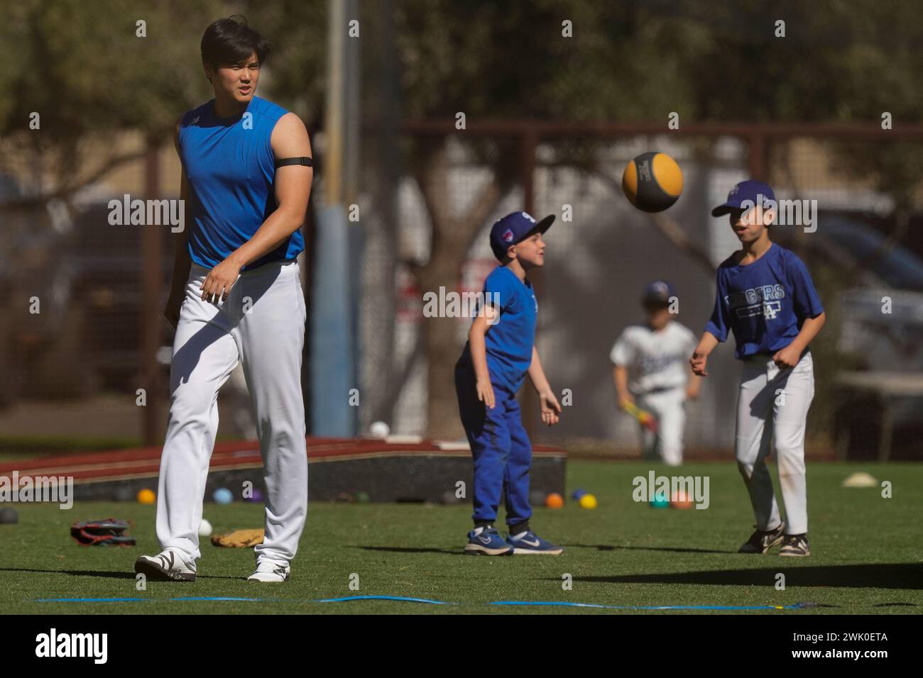 Los Angeles Dodgers' Shohei Ohtani walks to the clubhouse during spring ...