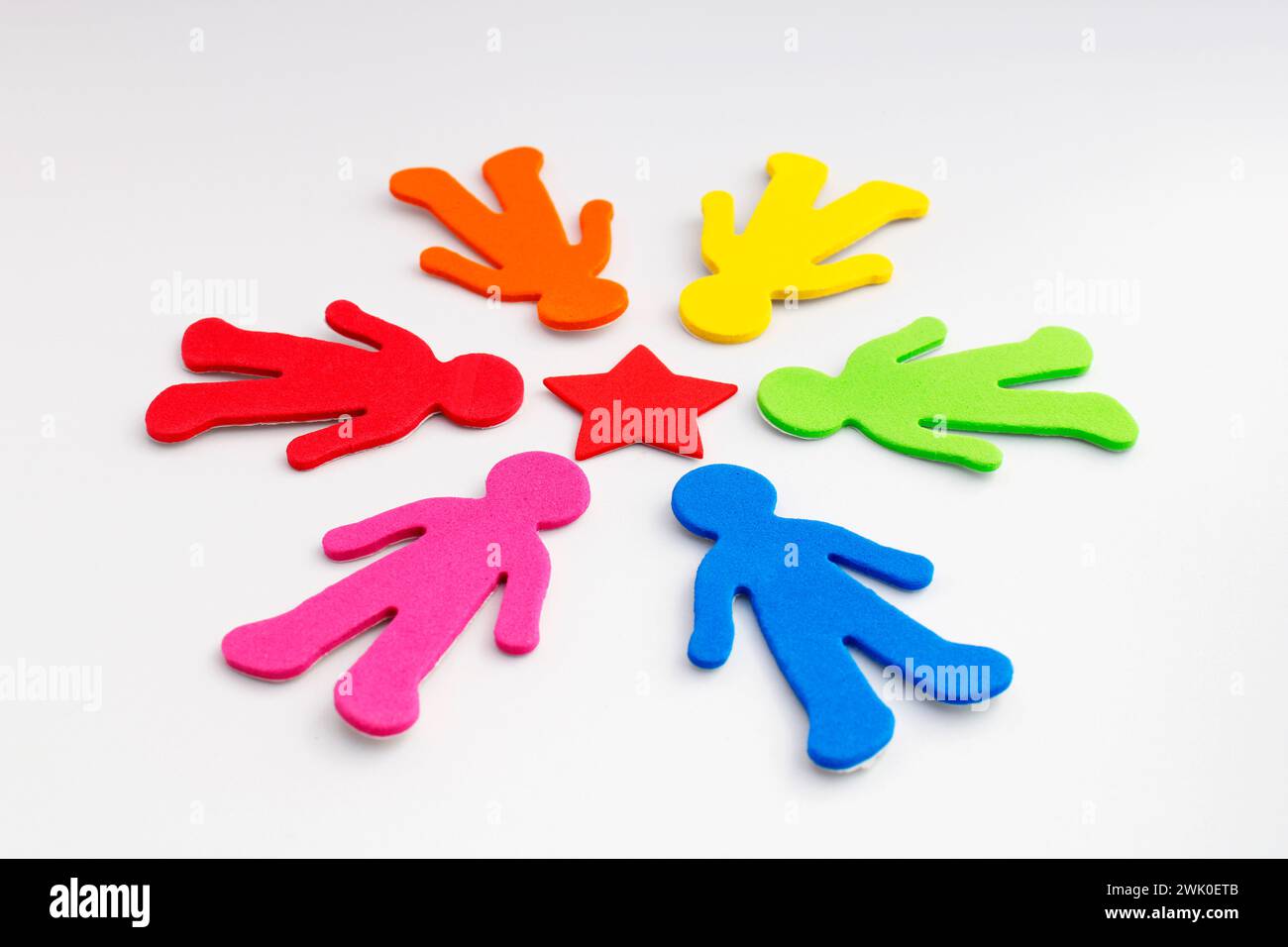 Silhouettes of people with different color around a star Stock Photo ...