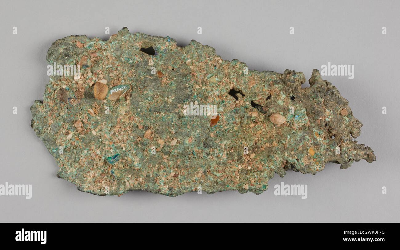 Agglomerate of half -melted objects (bronze, spearhead, charcoal ...