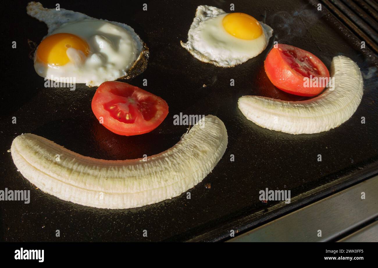 Breakfast BBQ stop three simple ingredients sizzling Stock Photo - Alamy