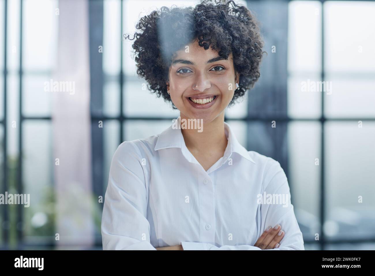business woman looks admiringly into the distance through the glass ...