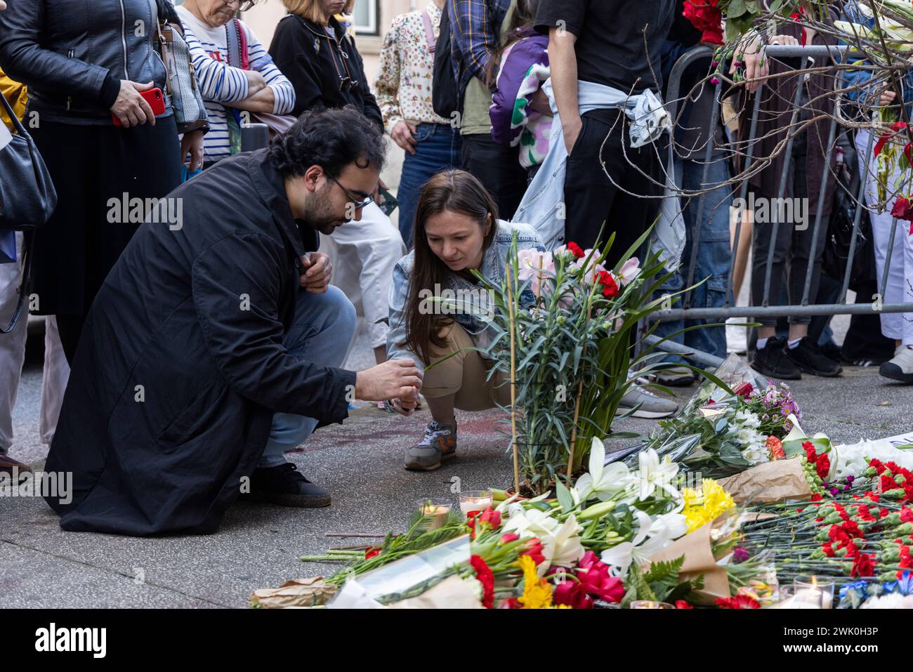 Lisbon, Portugal. 17th Feb, 2024. A person is seen lighting candles ...