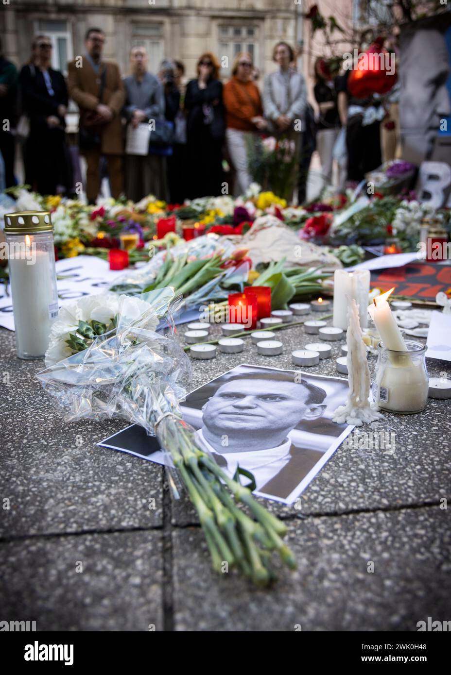 Lisbon, Portugal. 17th Feb, 2024. Flowers, candles, and a picture of ...