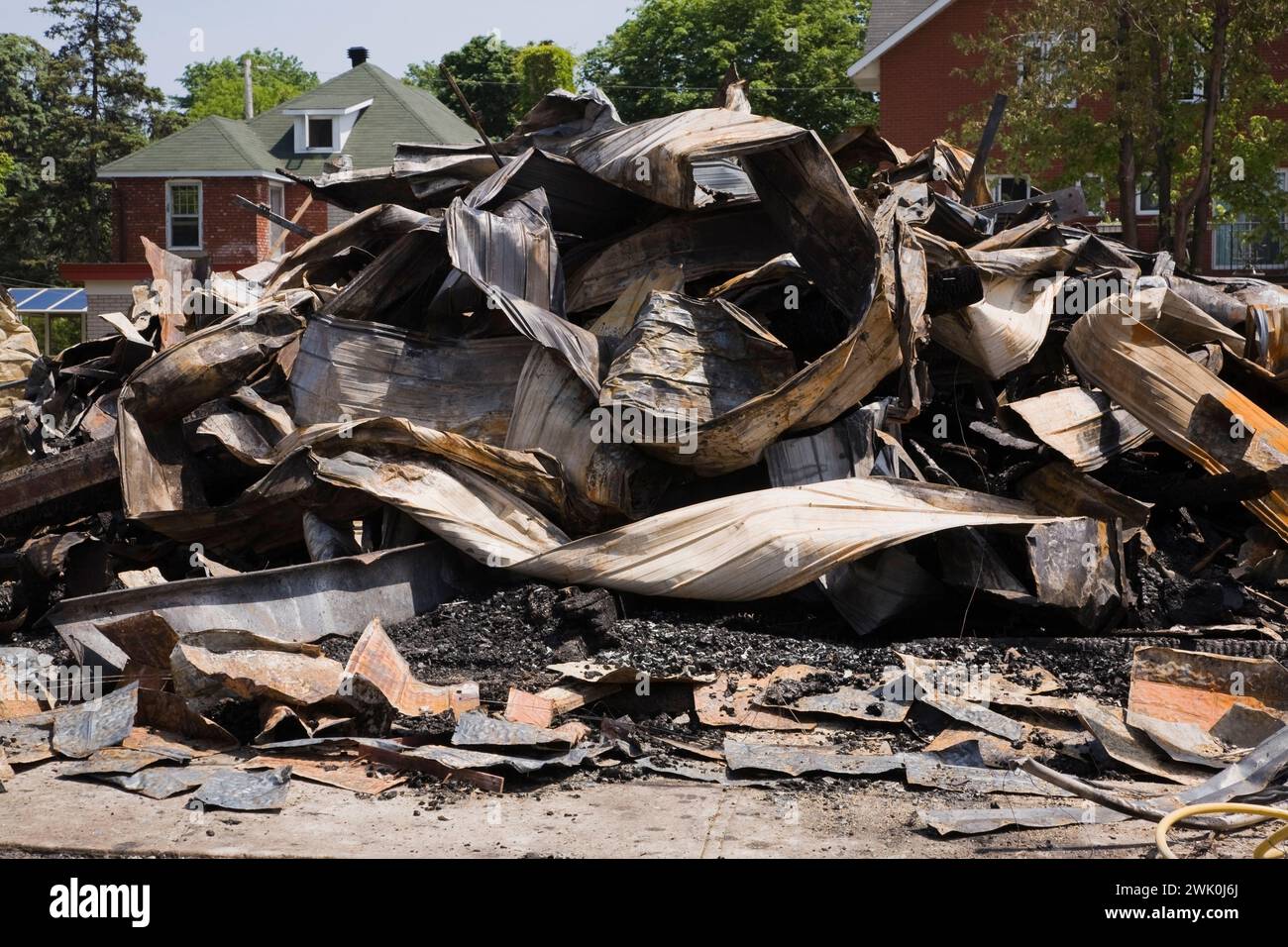 Remnants of burnt down commercial building in residential neighbourhood ...