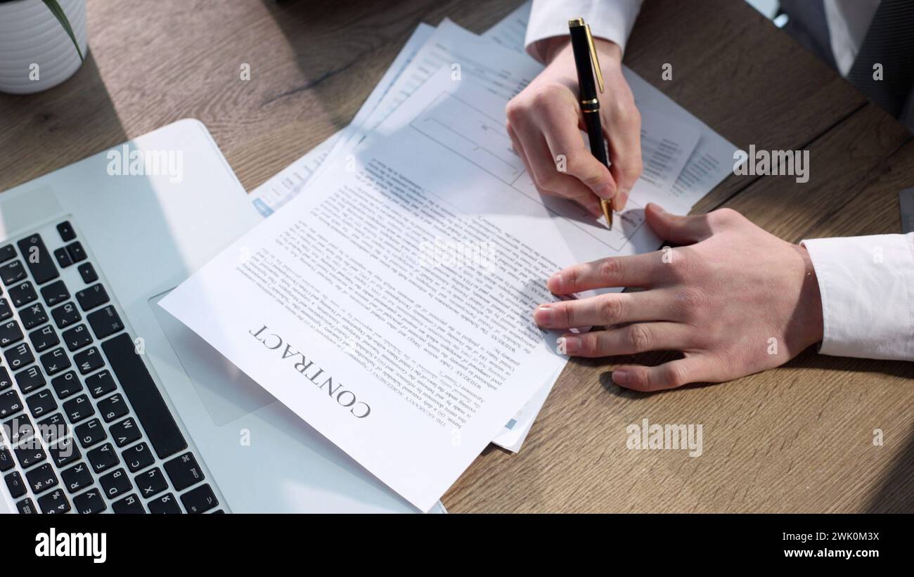 Signing a business contract, teamwork is a success Stock Photo - Alamy