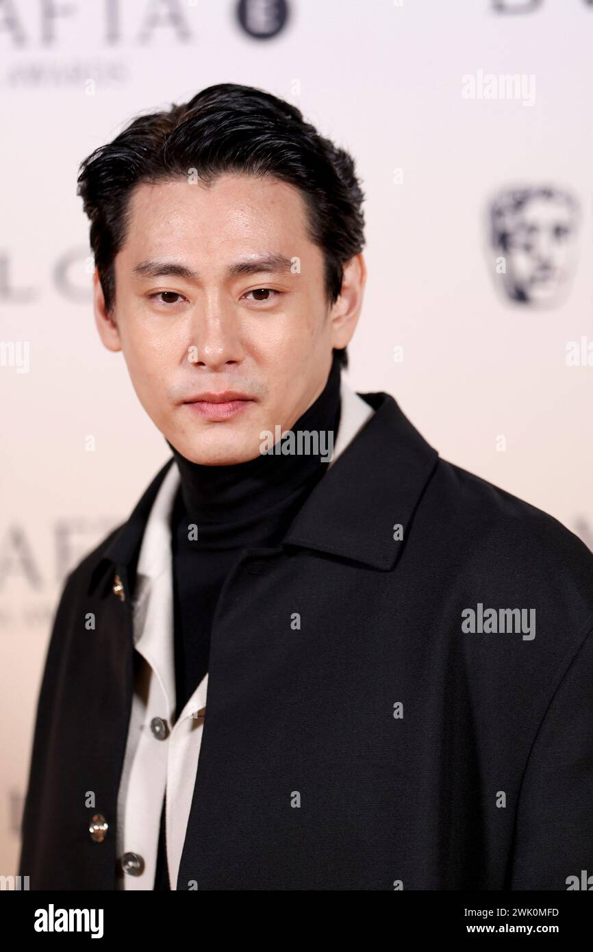 Teo Yoo poses for photographers upon arrival for the BAFTA Nominees ...