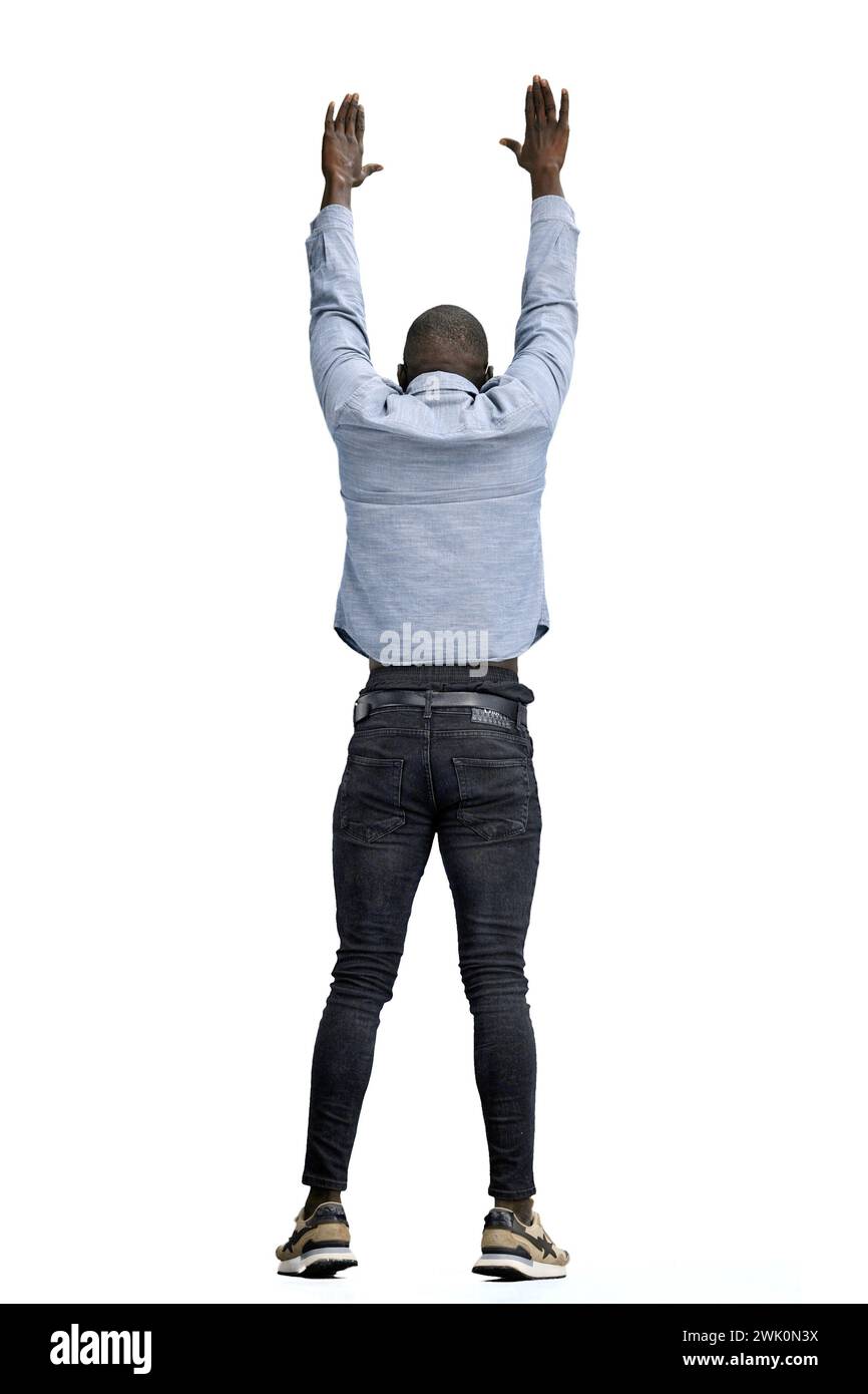 A man, full-length, on a white background, raised his hands up Stock ...