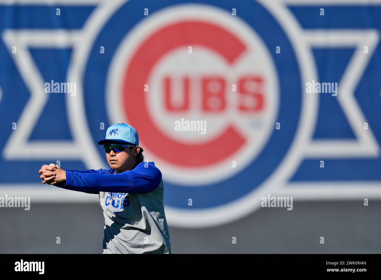 Chicago Cubs pitcher Shota Imanaga stretches during a baseball spring ...