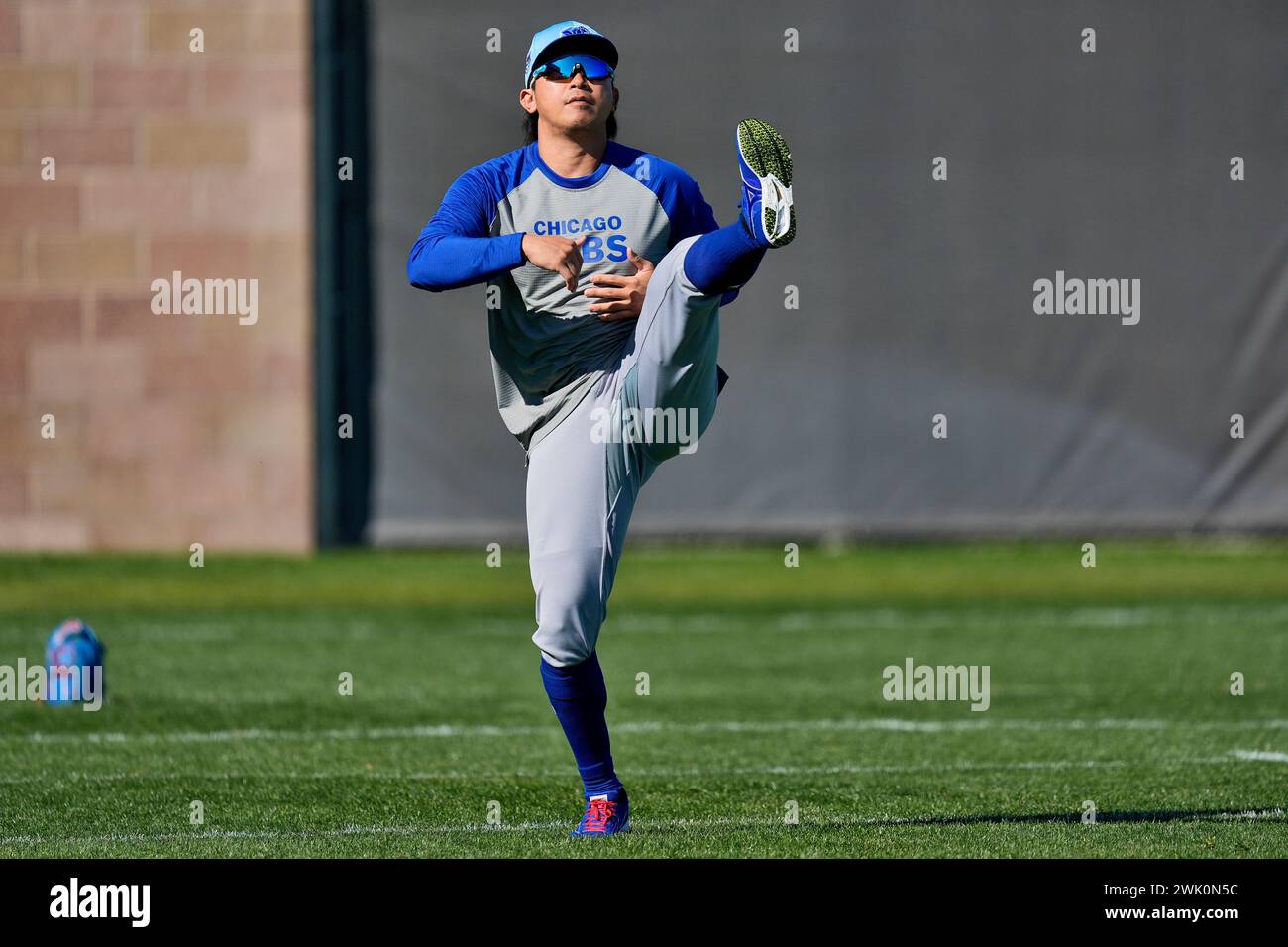 Chicago Cubs pitcher Shota Imanaga stretches during a baseball spring ...
