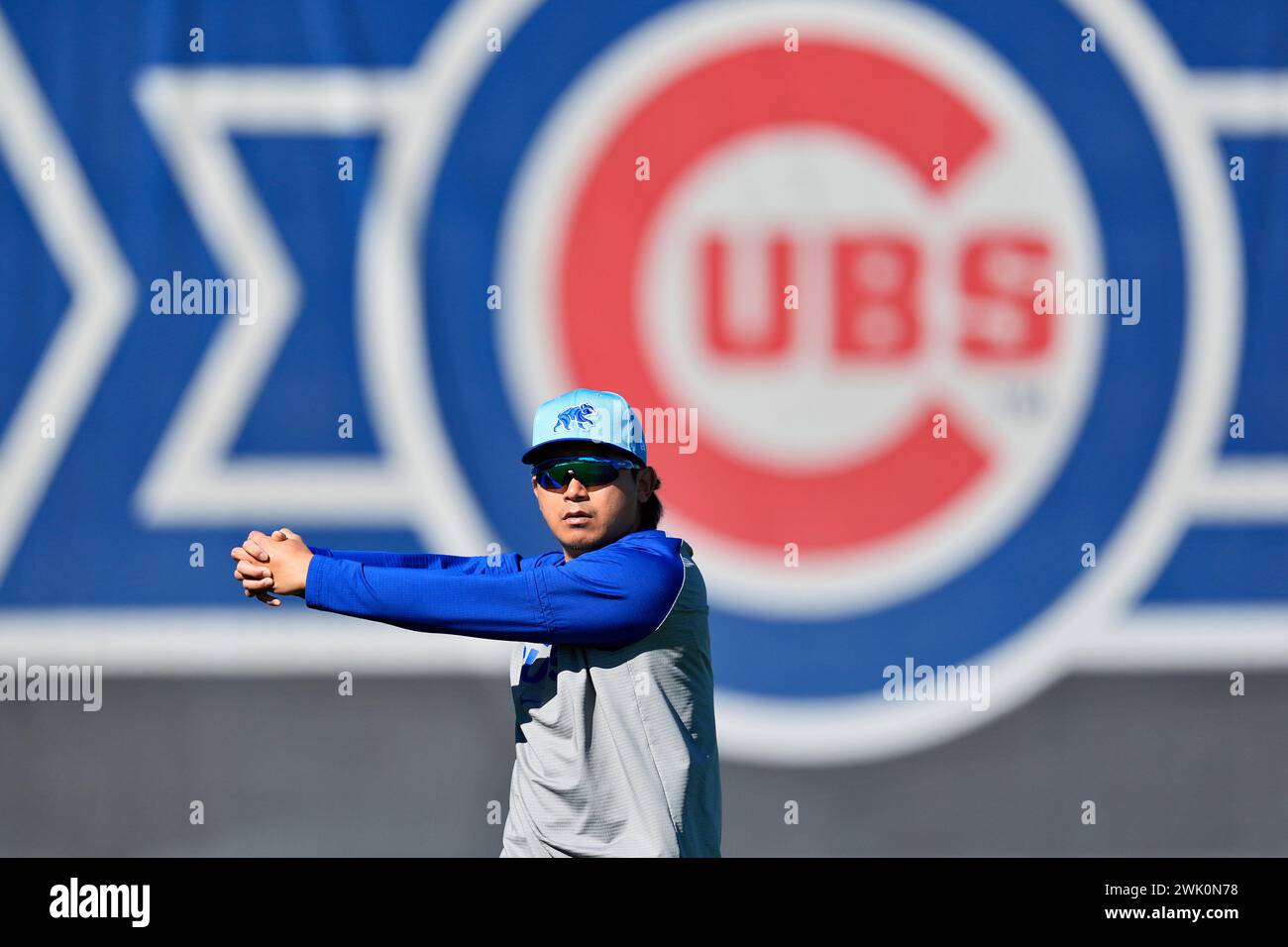 Chicago Cubs pitcher Shota Imanaga stretches during a baseball spring ...