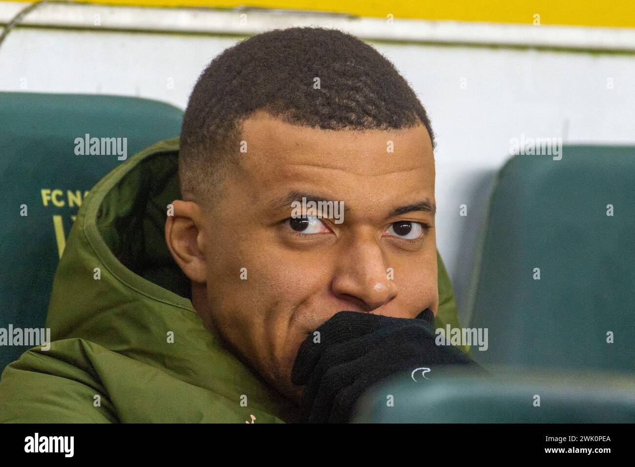 PSG's Kylian Mbappe looks out from the bench before the French League ...